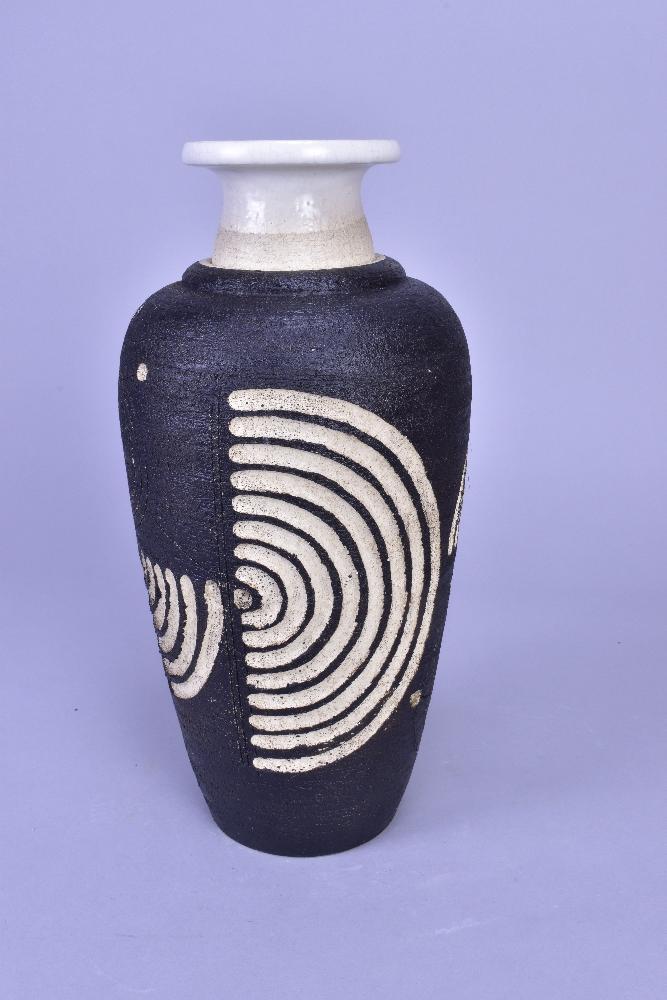 PATRICK OATES (born 1948); a stoneware bottle with incised decoration ...