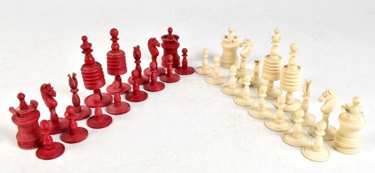 A carved bone and red stained bone chess - auctions & price archive
