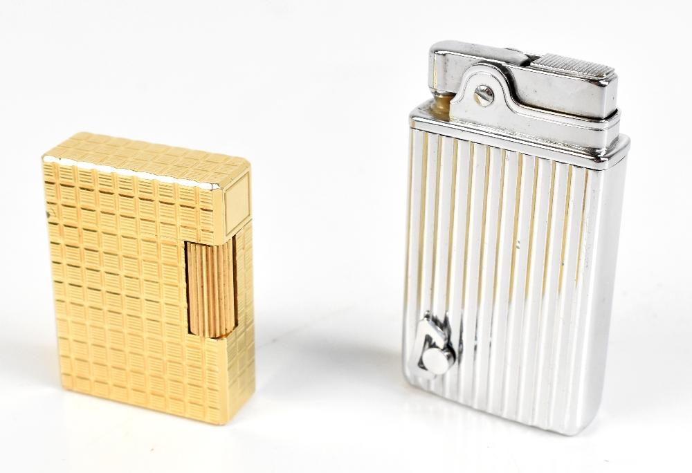 S.L. DUPONT; a French cigarette lighter, 5 x 3.5cm, and a Crown musical ...