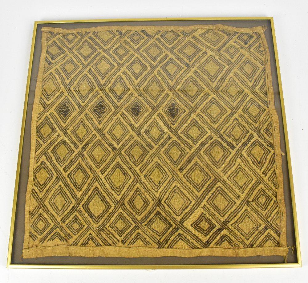 A Kuba tribe textile panel with geometric design, 49 x 48cm, framed and ...
