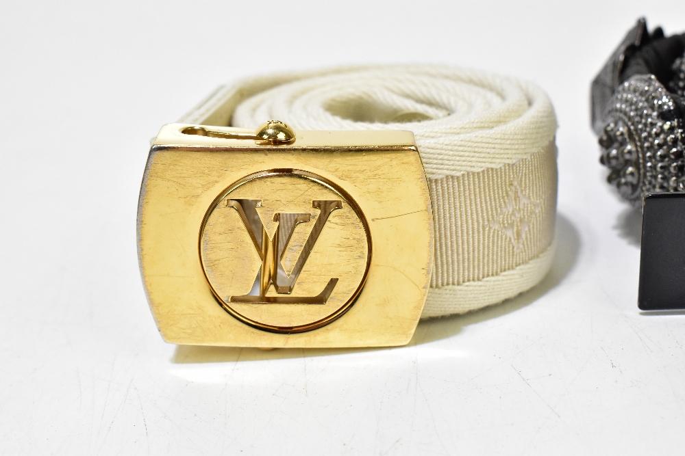 LOUIS VUITTON; a white cloth belt with gold tone buckle, length 93cm, a ...