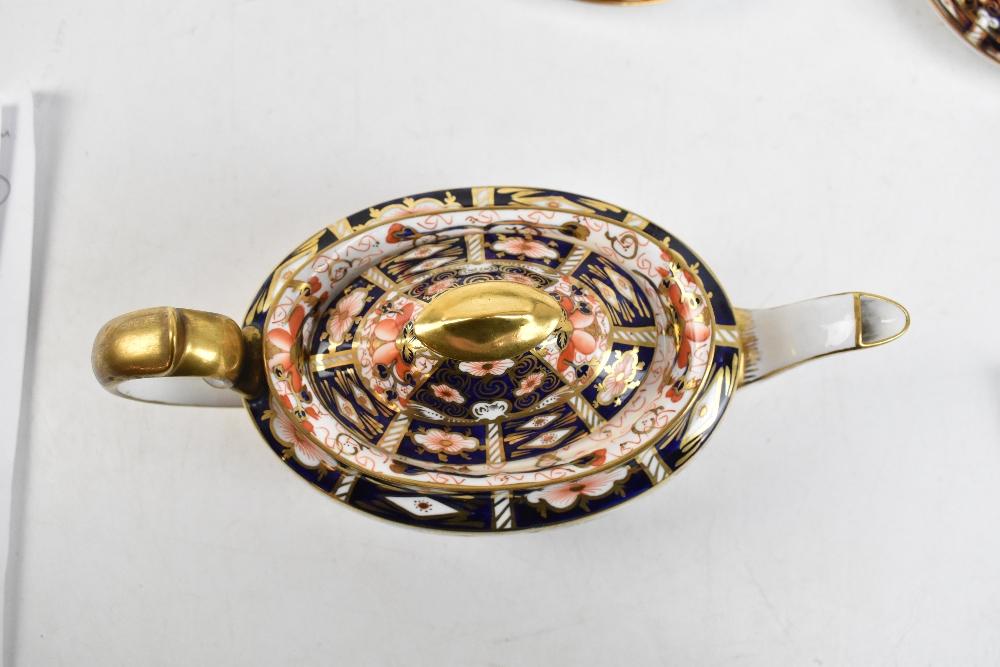 ROYAL CROWN DERBY; a forty-seven piece tea service decorated in the ...