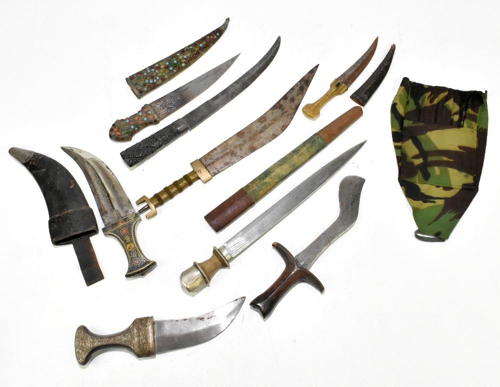 A group of North African/Middle Eastern blades including jambiyas, one ...
