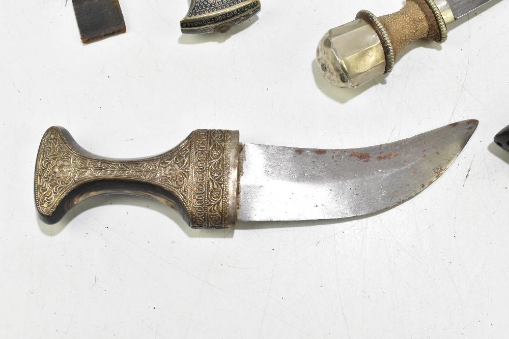 A group of North African/Middle Eastern blades including jambiyas, one ...