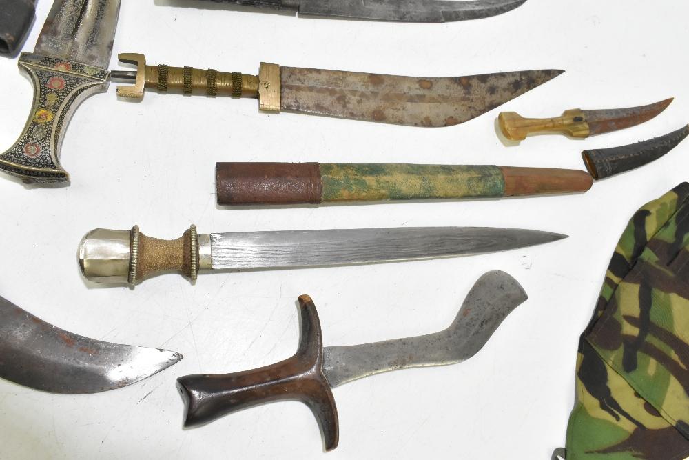 A group of North African/Middle Eastern blades including jambiyas, one ...