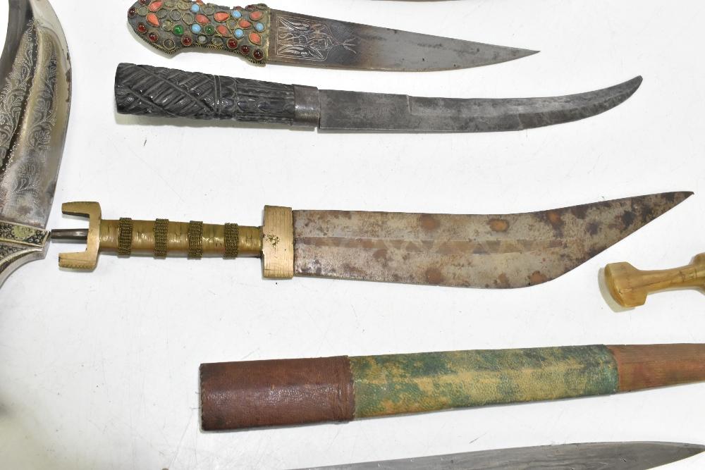 A group of North African/Middle Eastern blades including jambiyas, one ...