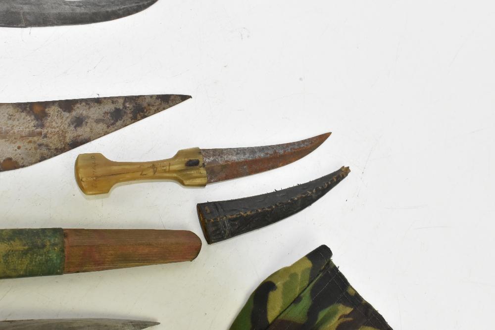 A group of North African/Middle Eastern blades including jambiyas, one ...