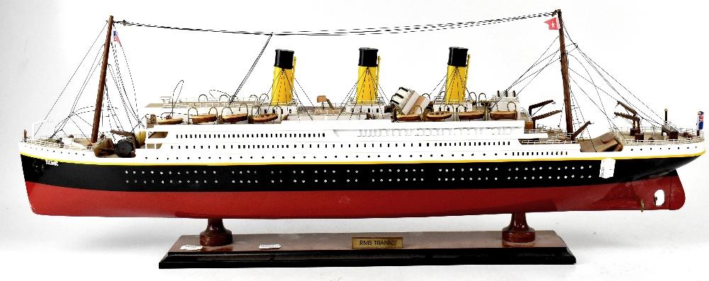 A kit model of RMS Titanic, on a rectangular wooden stand, length 80cm ...