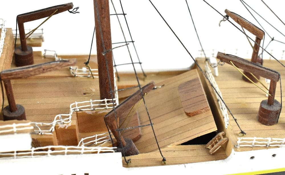 A kit model of RMS Titanic, on a rectangular wooden stand, length 80cm ...