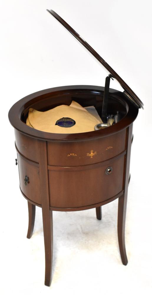 An oval mahogany cased gramophone in the Edwardian style, to splayed ...