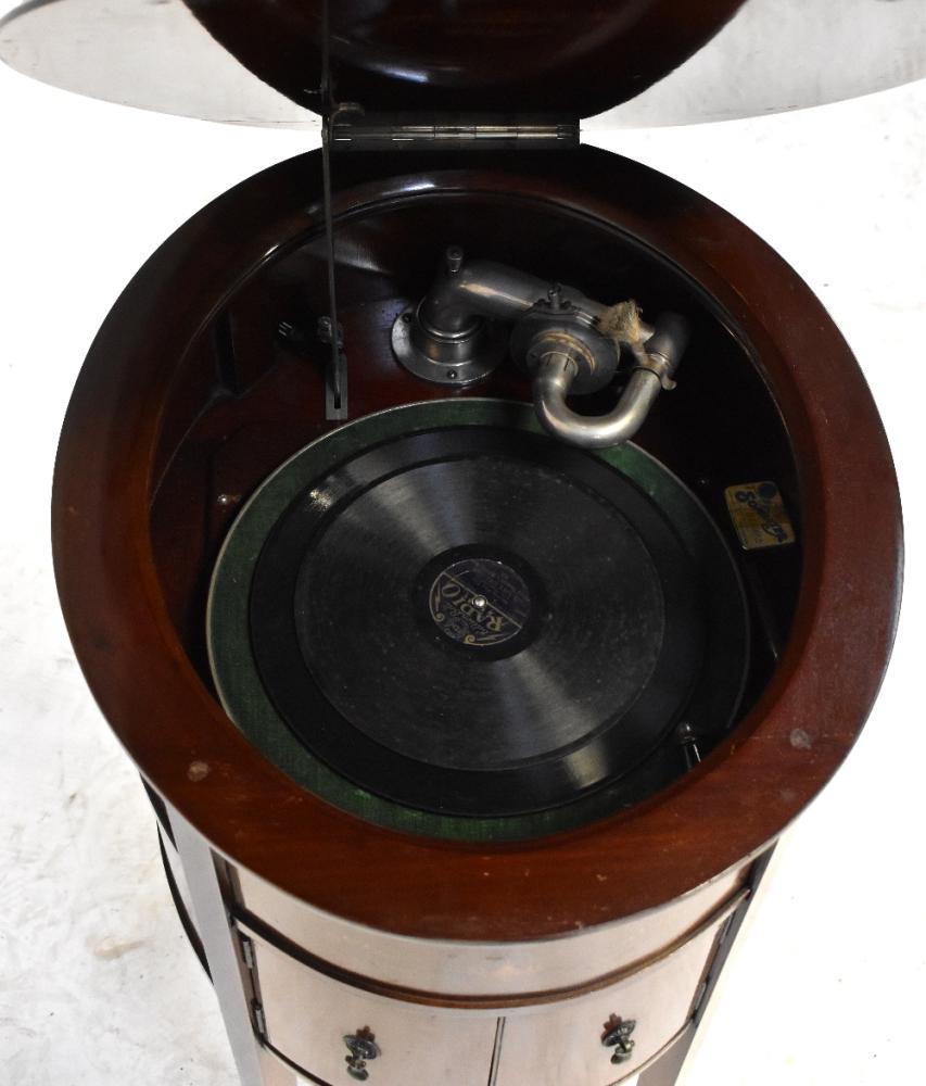 An oval mahogany cased gramophone in the Edwardian style, to splayed ...
