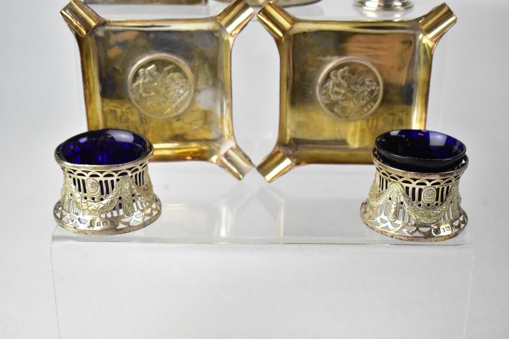 A small collection of silverware comprising a small silver twin-handled ...