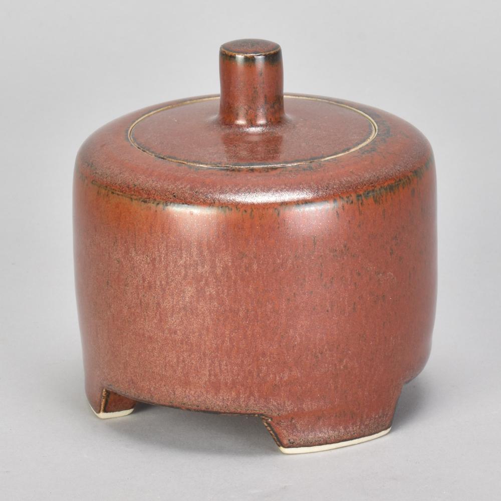 SULEYMAN SABA (born 1969); a stoneware jar and cover covered in iron ...