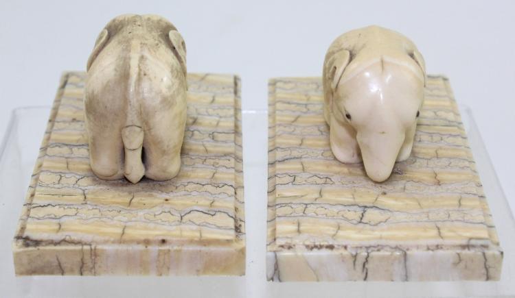 A pair of early 20th century Russian carved ivory and mammoth tooth ...