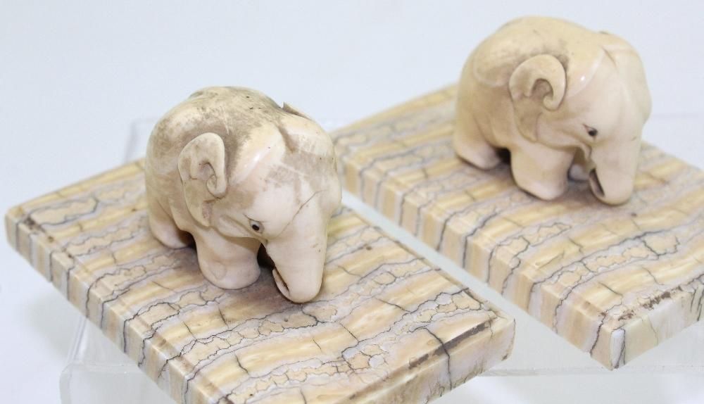 A pair of early 20th century Russian carved ivory and mammoth tooth ...