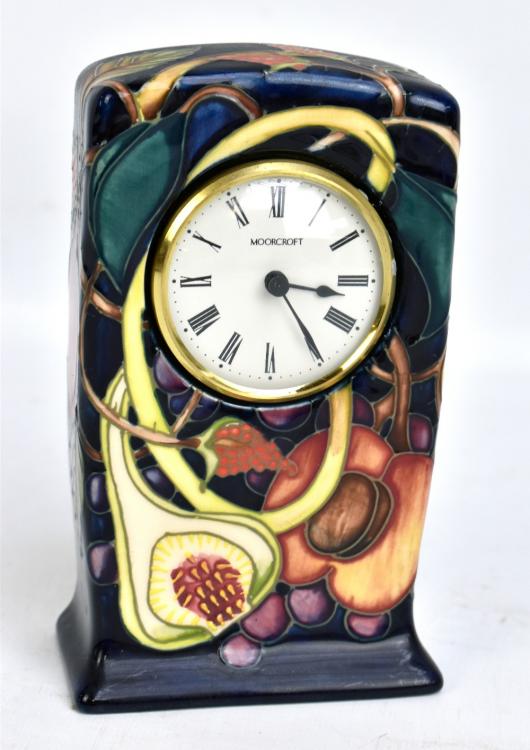 MOORCROFT; a 'Queen's Choice' pattern tube line decorated clock on navy ...