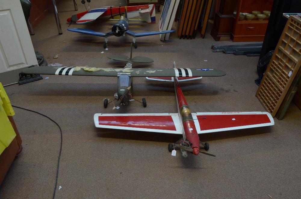 A glider in red and white, the wings inscribed 'Aerostar 62' and 'Dave ...