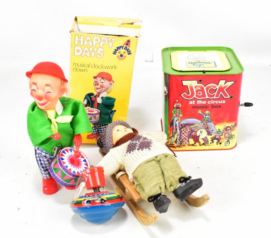 A small group of toys to include a Jack at the Circus music box, a doll ...