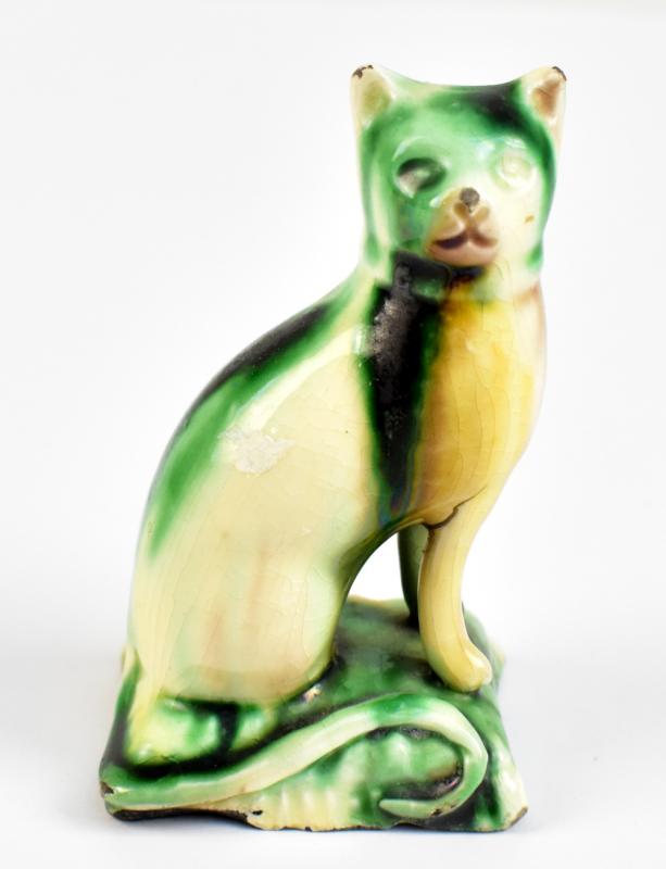 A late 18th/early 19th century Whieldon type figure of a seated cat ...